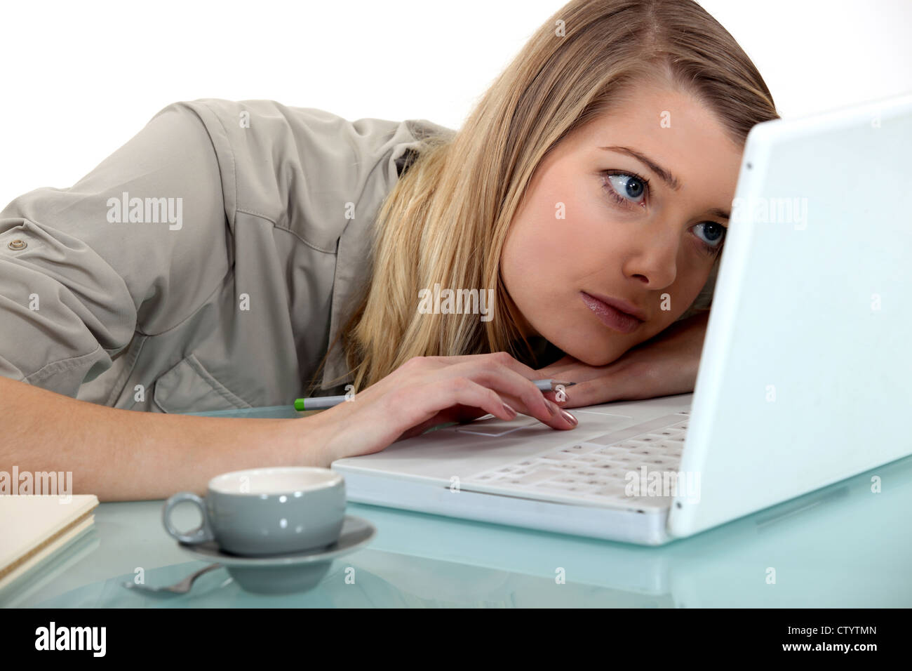 Young woman bored in front of computer Stock Photo - Alamy