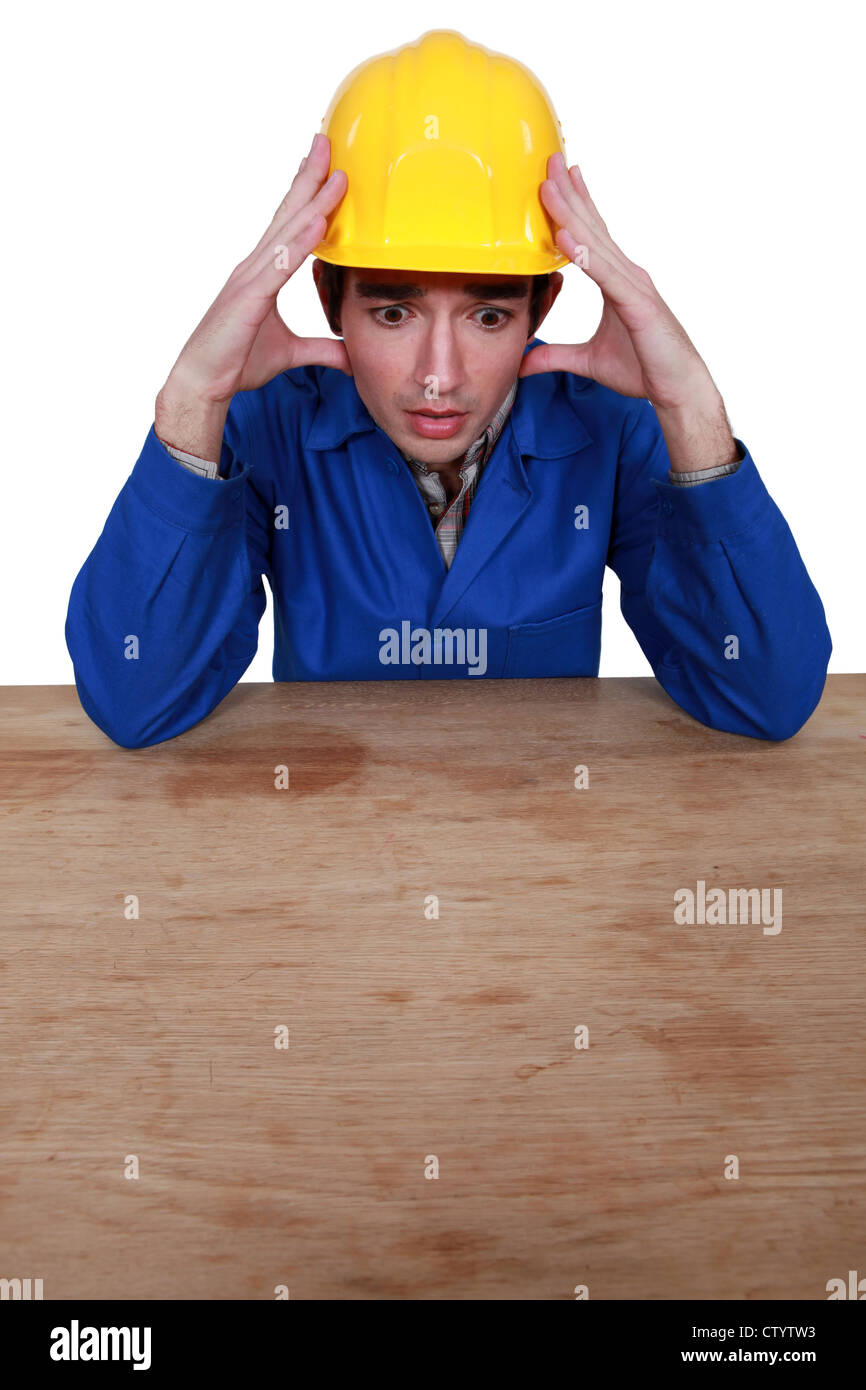 Stressed construction worker Stock Photo - Alamy