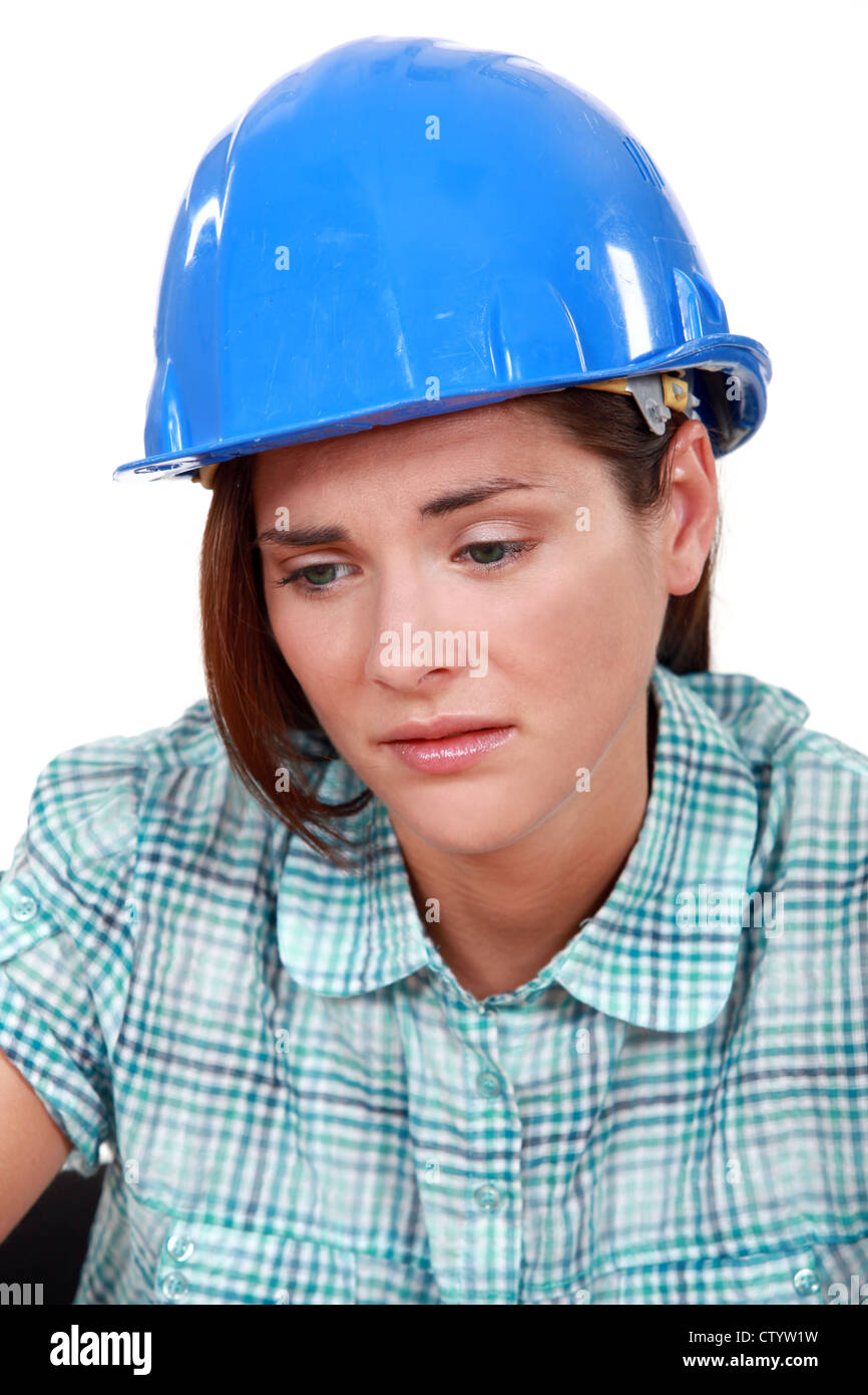 Sad female builder Stock Photo - Alamy