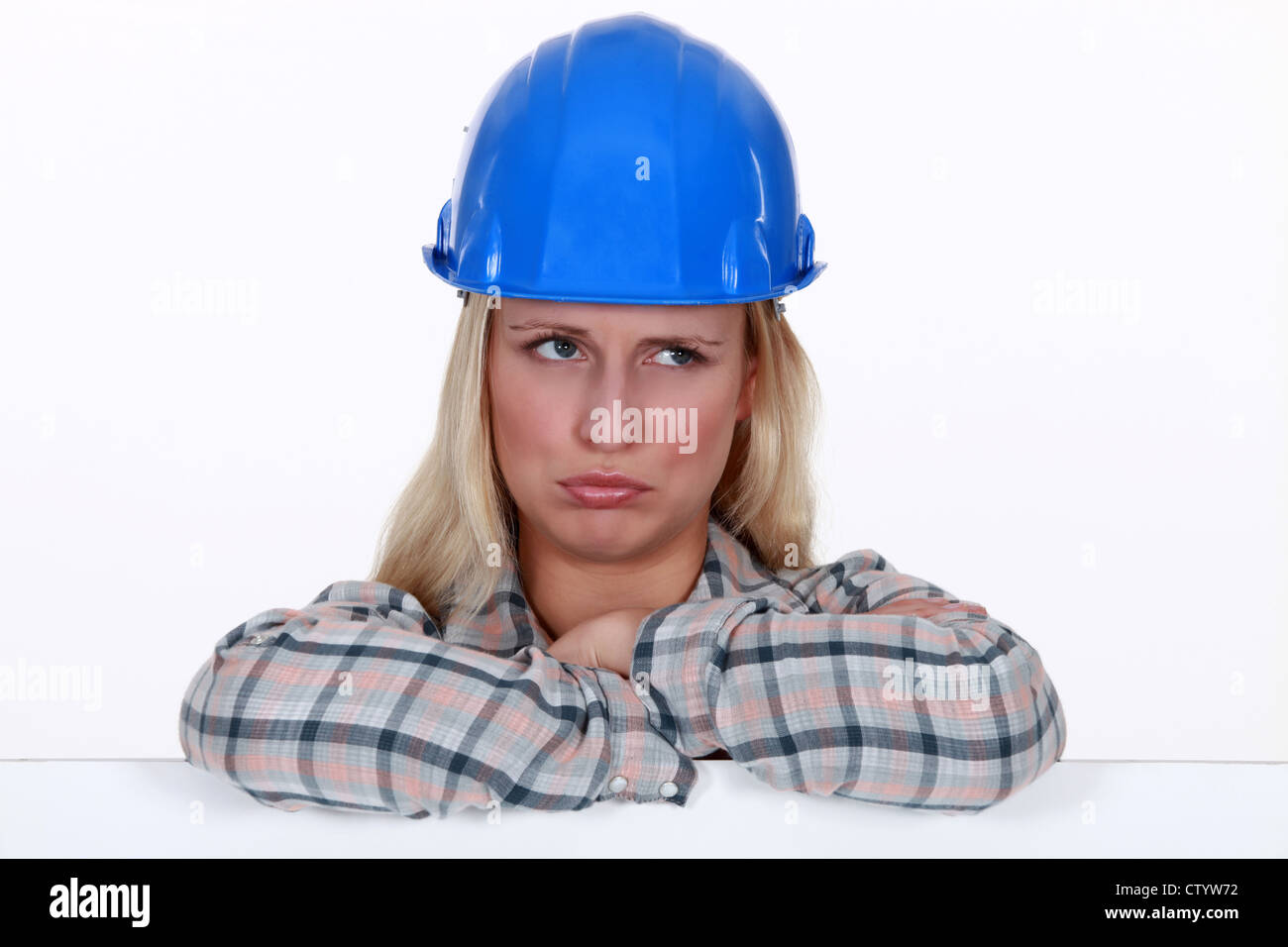 Sad female builder Stock Photo - Alamy