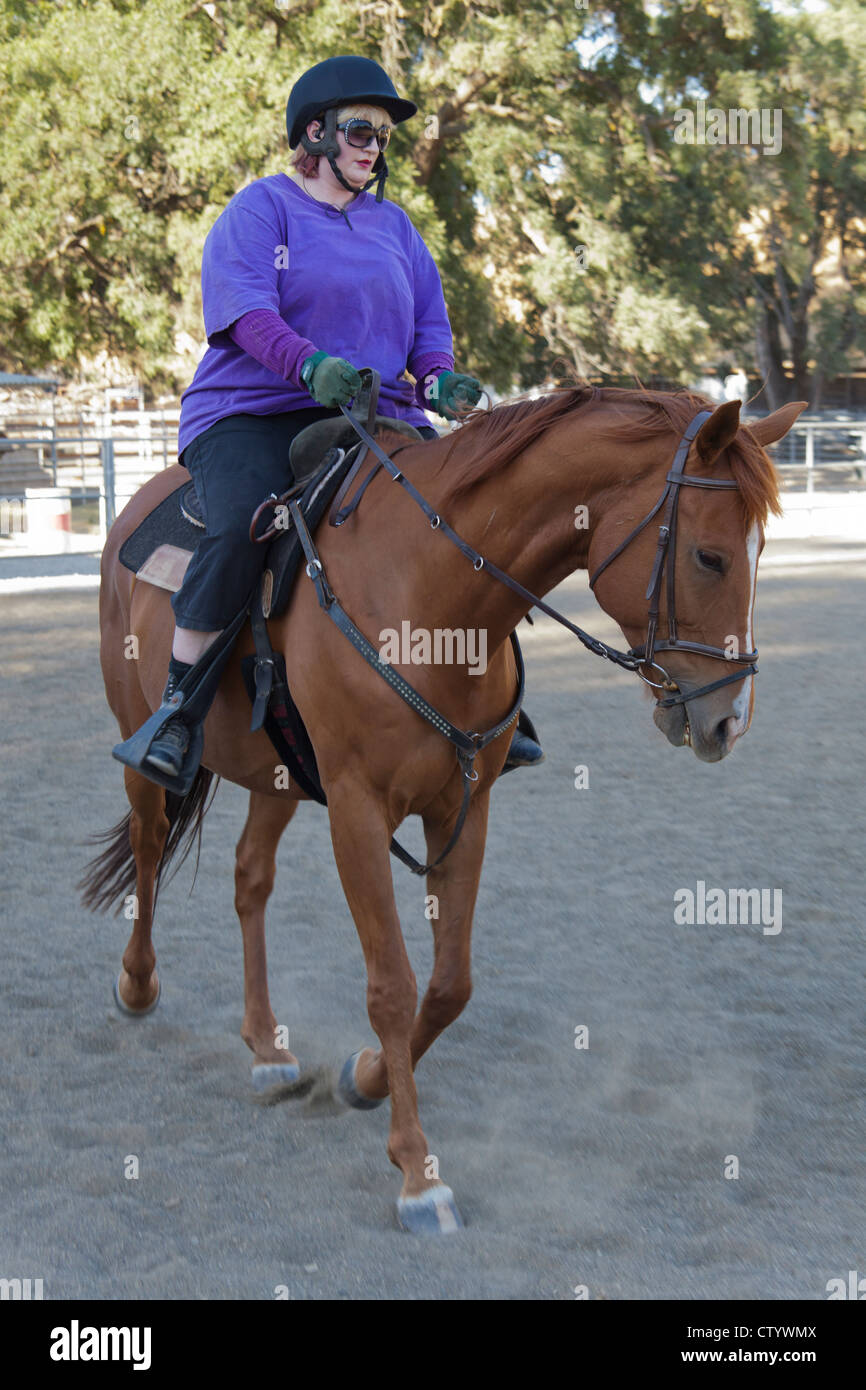 Woman wearing saddle hi-res stock photography and images - Alamy