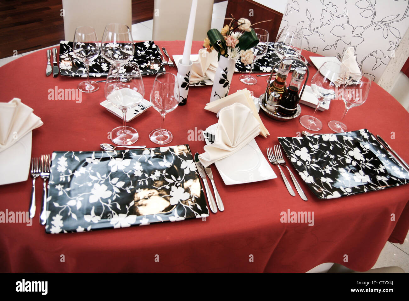 Table set for dinner in modern restaurant Stock Photo - Alamy