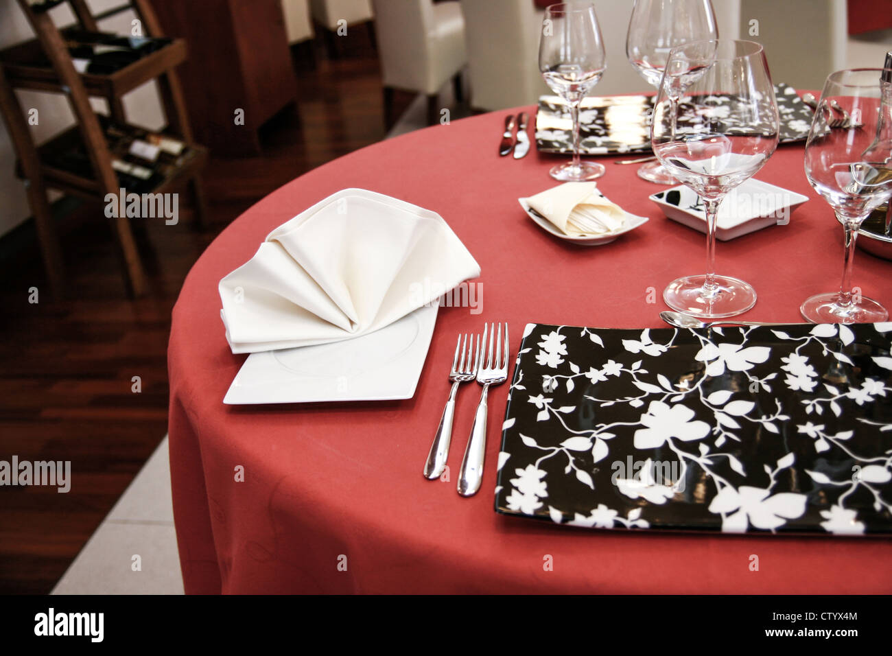 Table set for dinner in modern restaurant Stock Photo - Alamy