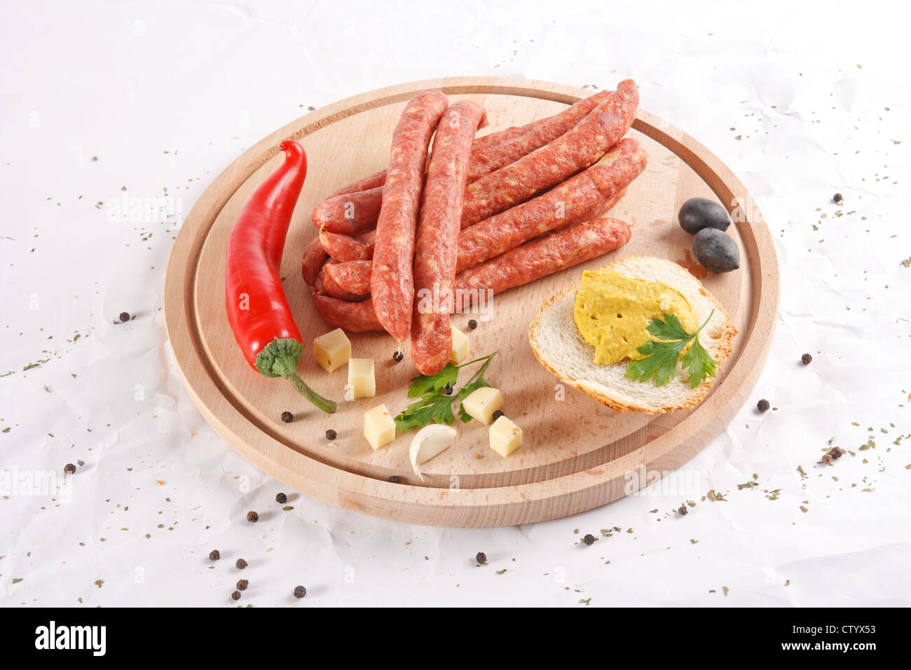Wooden Chopping Board With Sausages And Spices Stock Photo Alamy