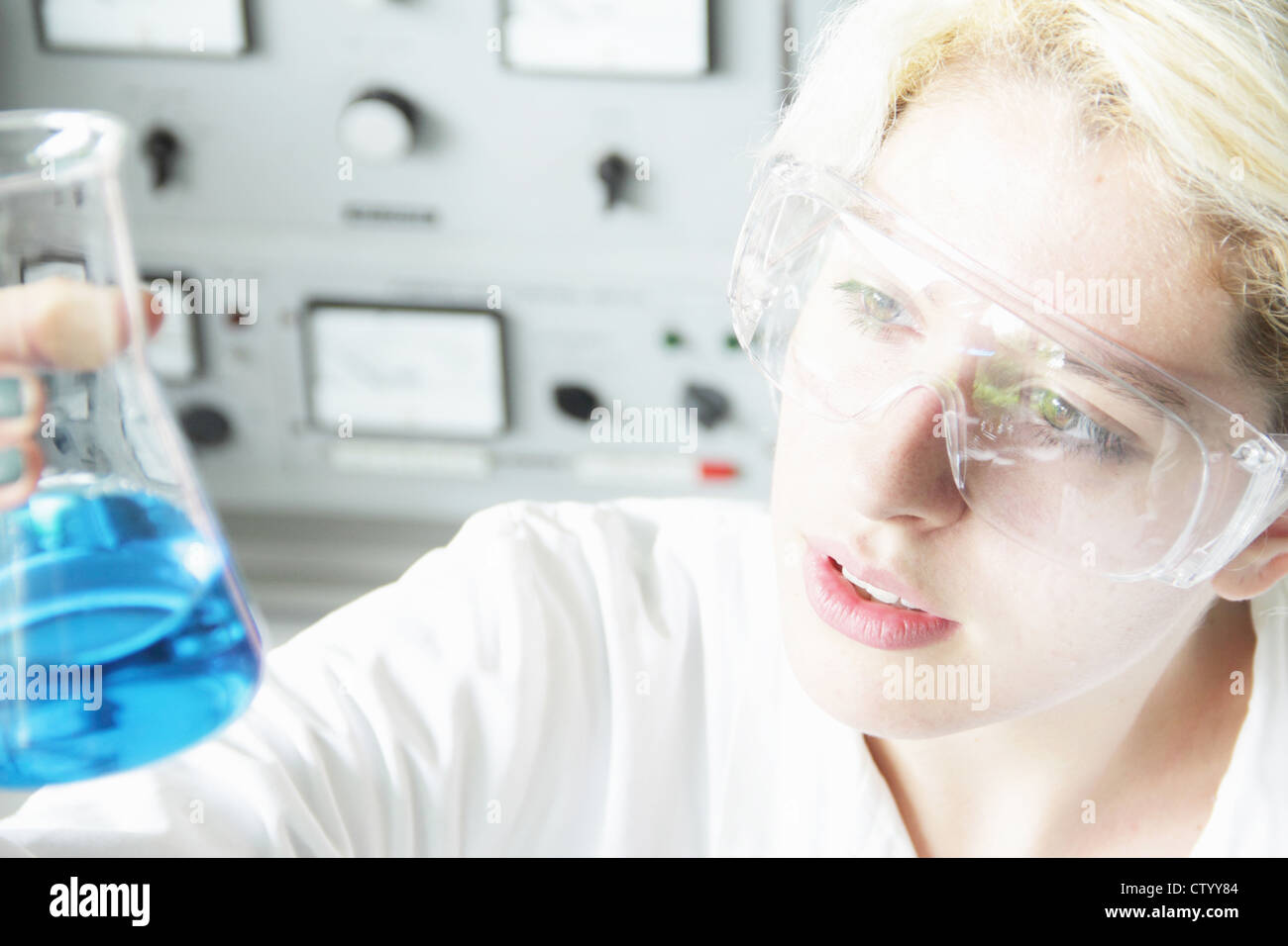 Scientist examining beaker of liquid Stock Photo - Alamy Scientist examining beaker of liquid Stock Photo - Alamy