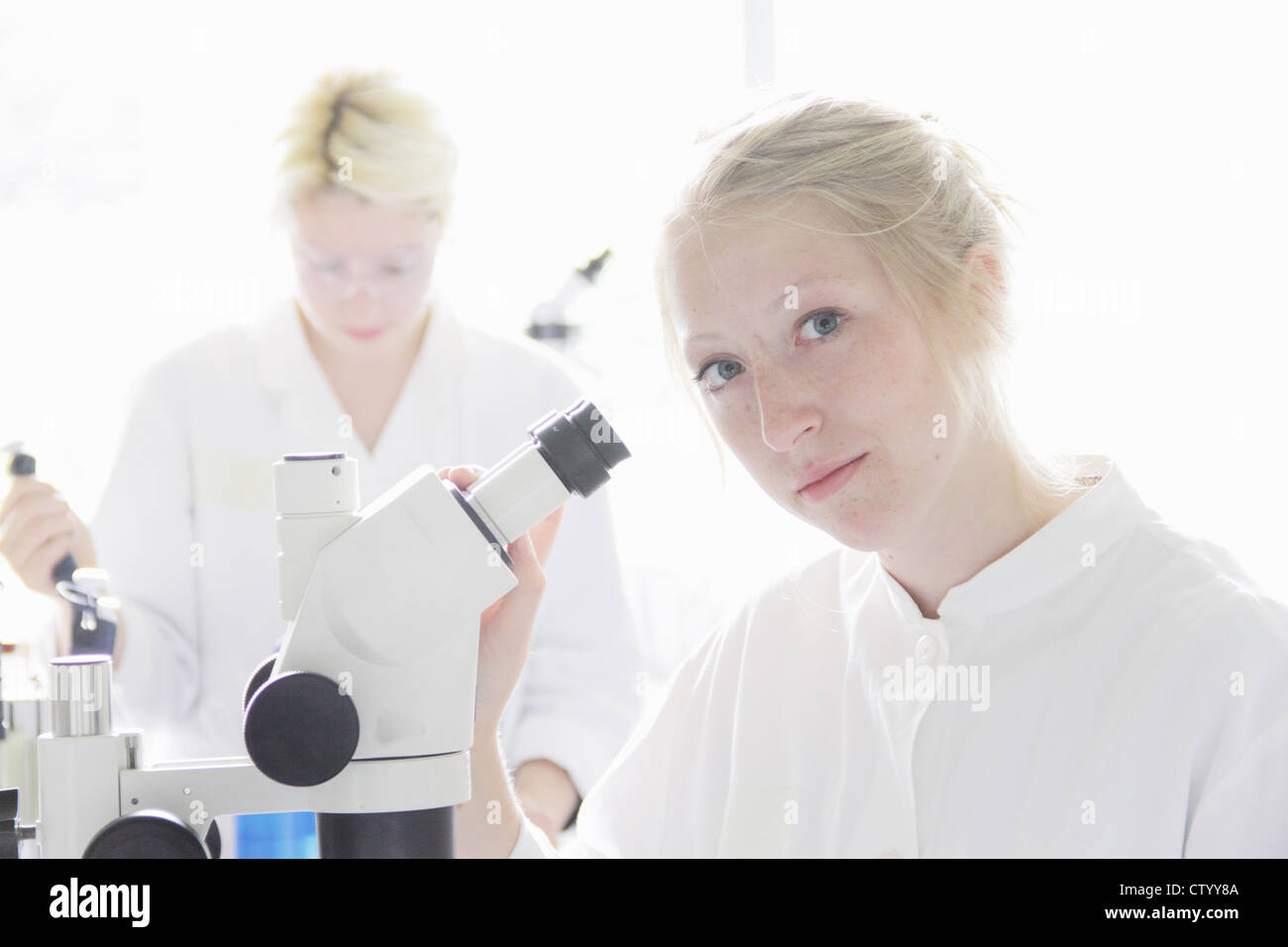 Scientist at microscope in lab Stock Photo - Alamy