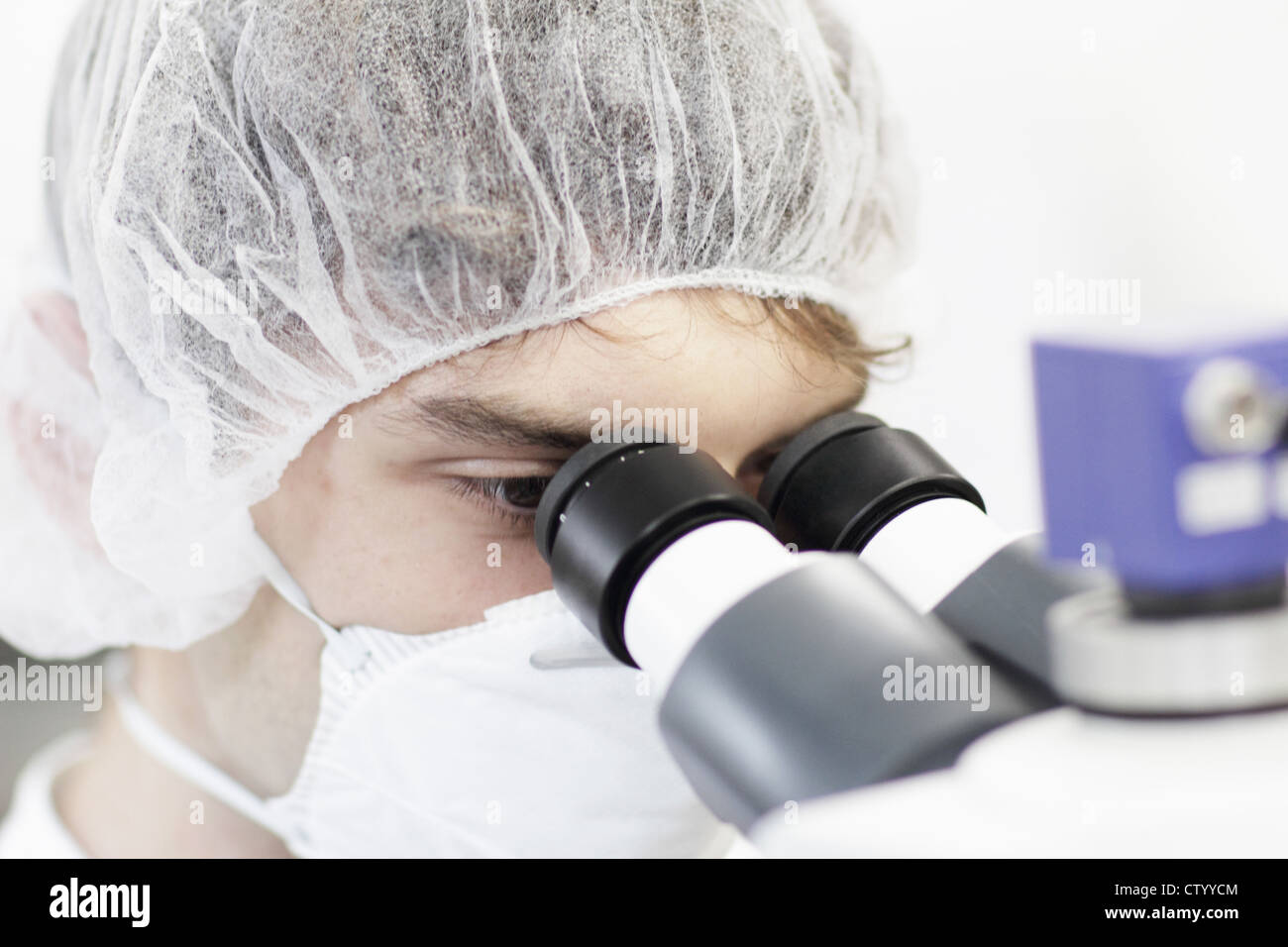 Scientist using microscope in lab Stock Photo - Alamy