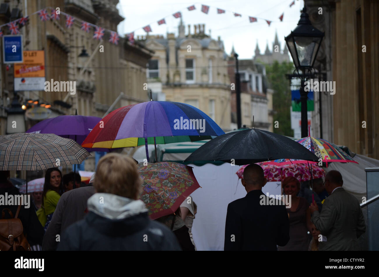 Crowded street on a rainy day with people holding umbrellas Stock Photo ...