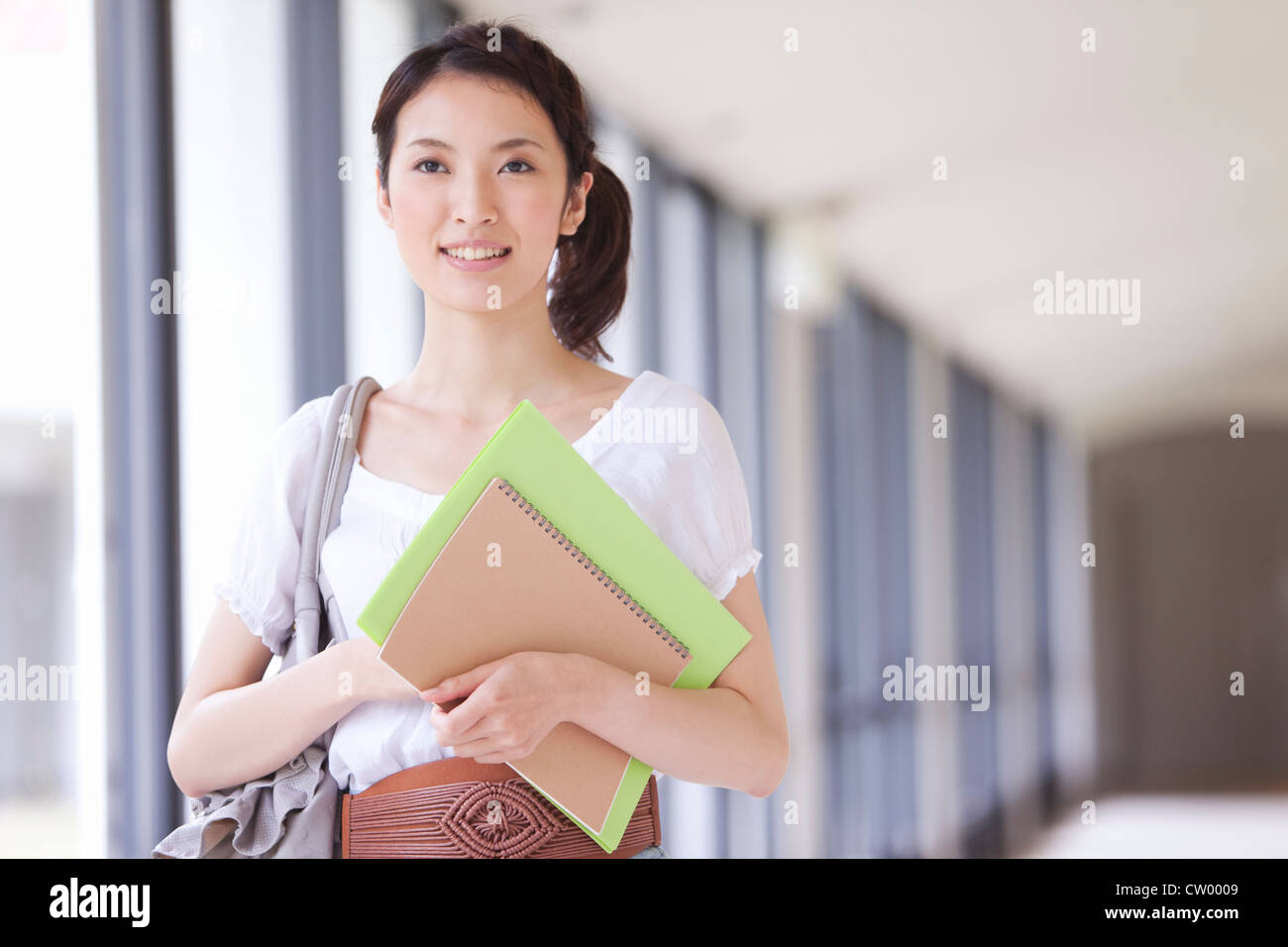 Young university student woman smiling Stock Photo - Alamy