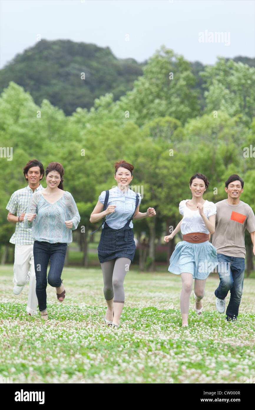 Five university students running Stock Photo - Alamy
