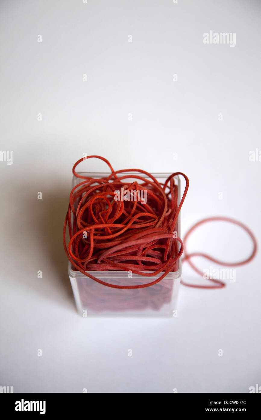 Red Elastic Bands in Container Stock Photo - Alamy