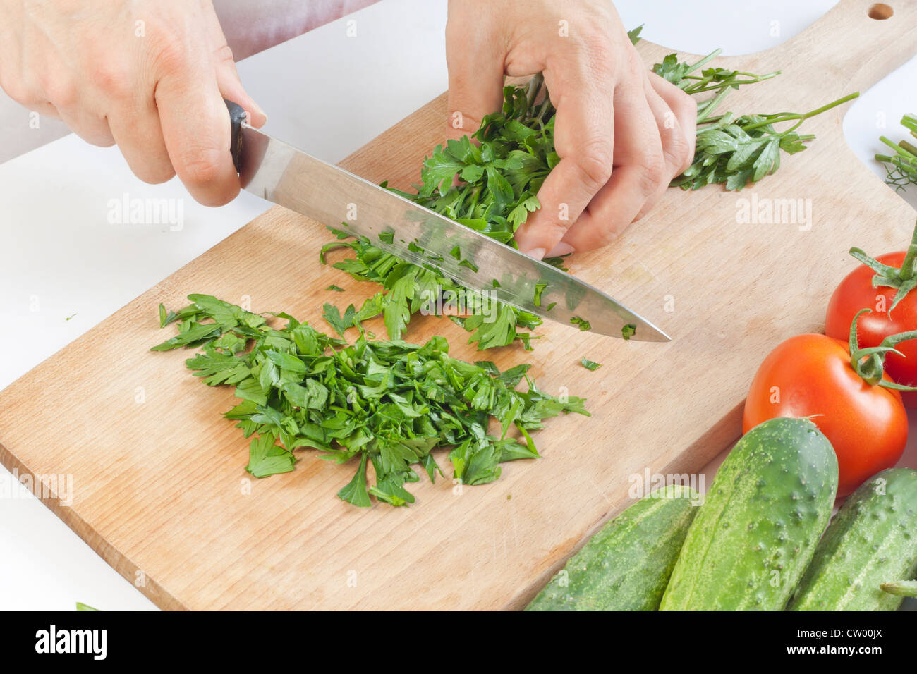 Cook in the kitchen at work cutting vegetables Stock Photo - Alamy