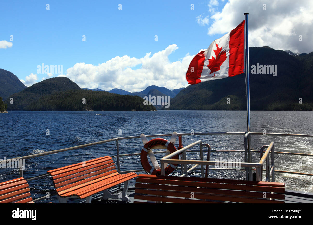 View of Nootka Sound from MV Uchuck with Canadian flag Stock Photo - Alamy