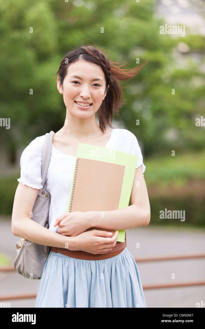 Young university student woman smiling Stock Photo - Alamy