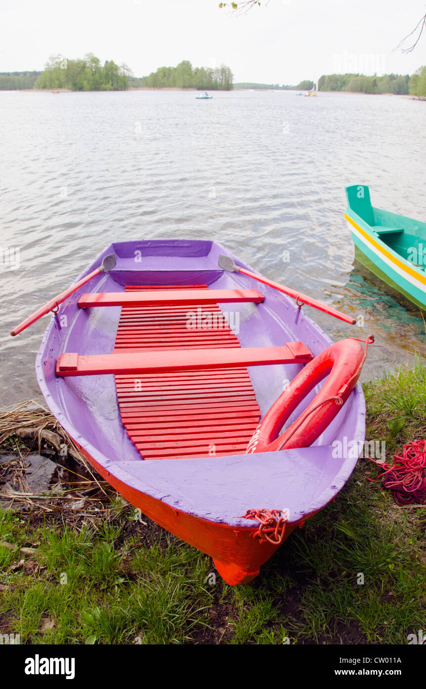 colorful spring boat on lake near coast Stock Photo - Alamy