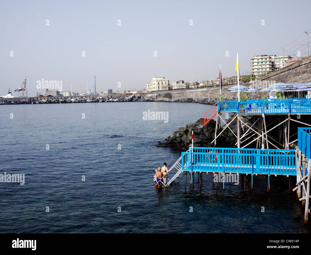 Morning bath next to the station in a private lido, Catania Stock Photo ...