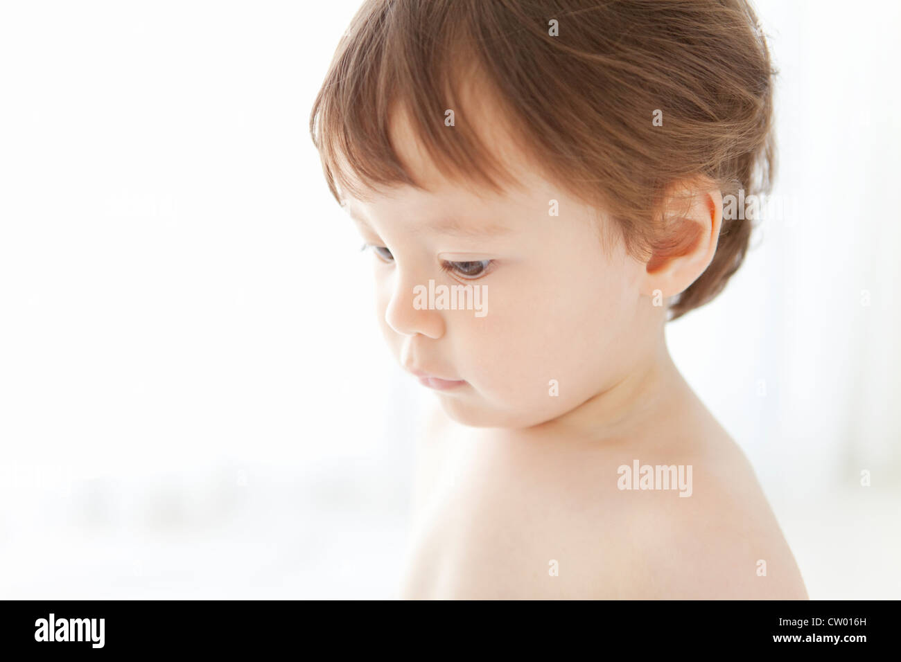 Baby boy Looking Down Stock Photo - Alamy