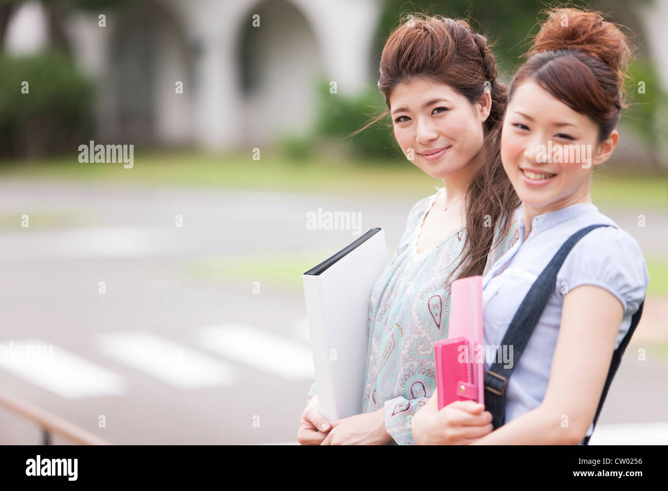 Female university students looking at camera Stock Photo - Alamy