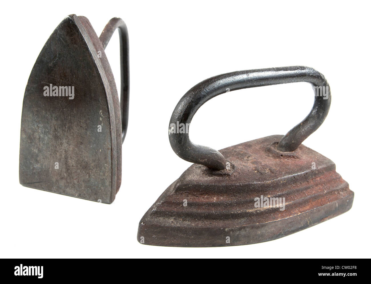 Two antique smoothing irons isolated over white background Stock Photo ...