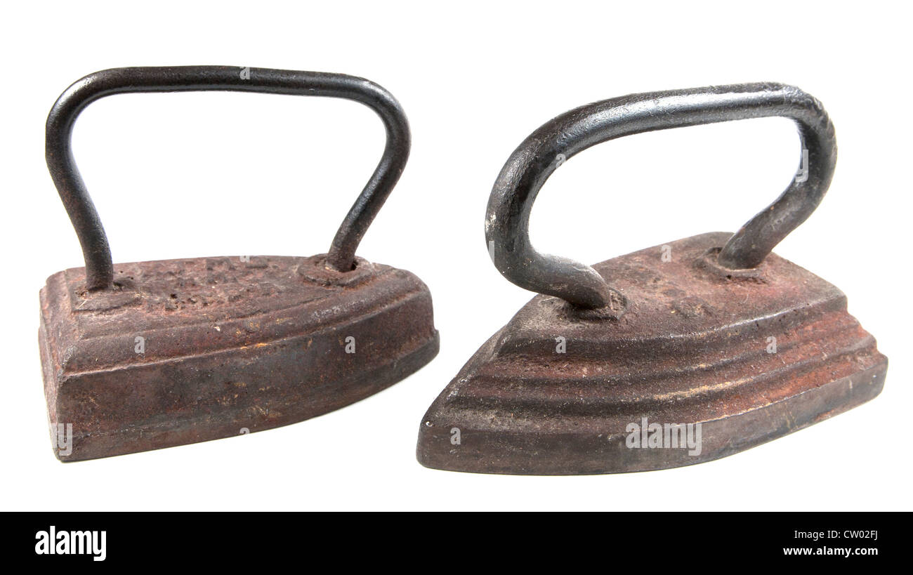 Two antique smoothing irons isolated over white background Stock Photo ...