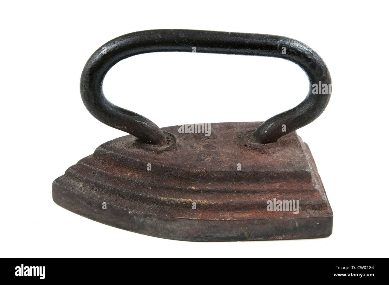 antique smoothing iron isolated over white background Stock Photo - Alamy