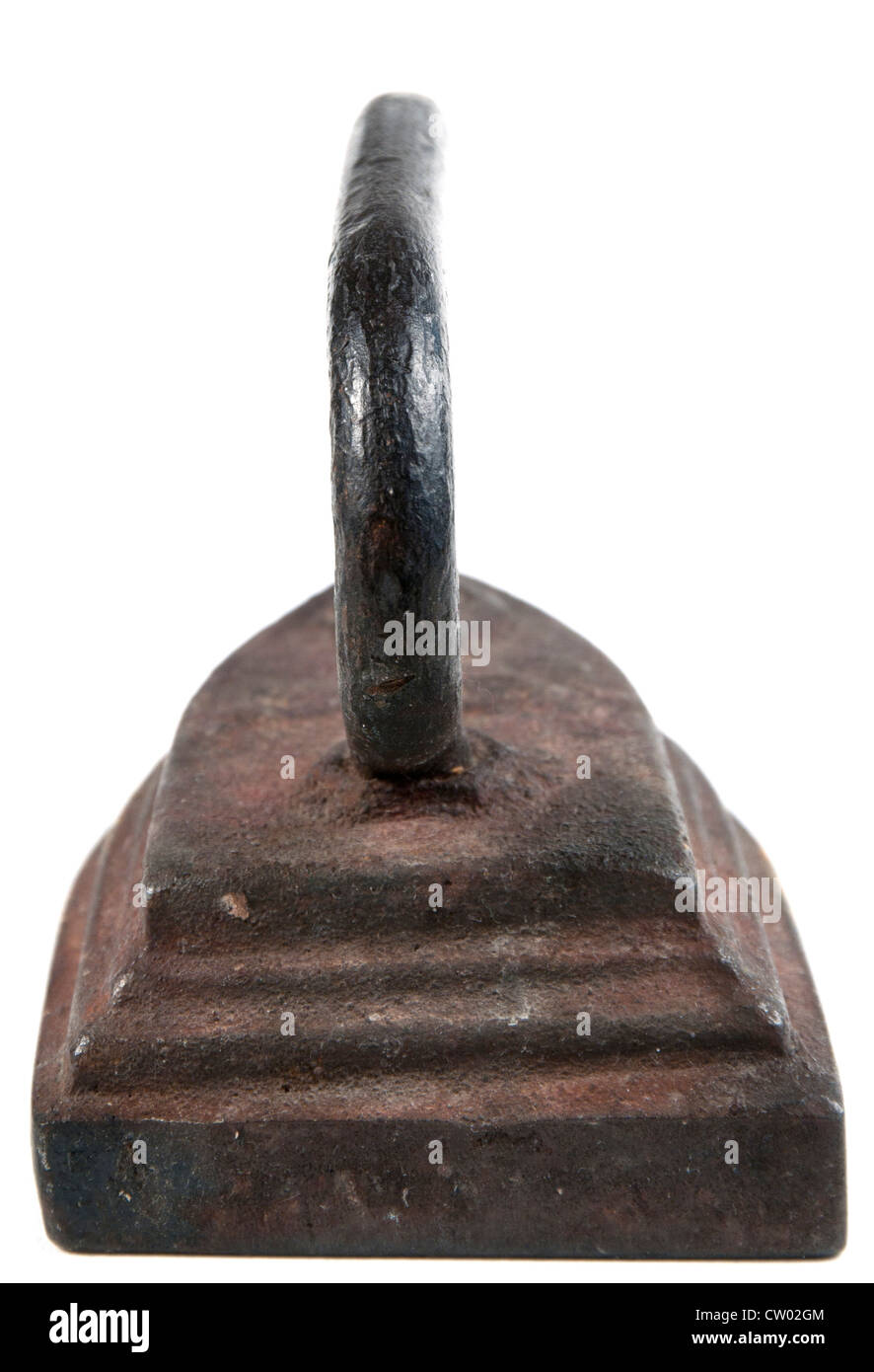 antique smoothing iron isolated over white background Stock Photo - Alamy