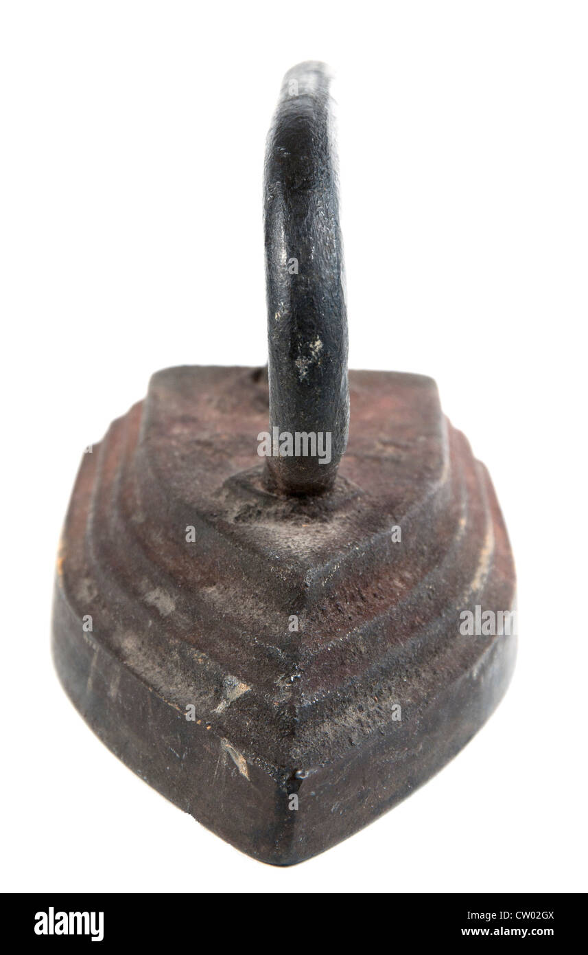 antique smoothing iron isolated over white background Stock Photo - Alamy