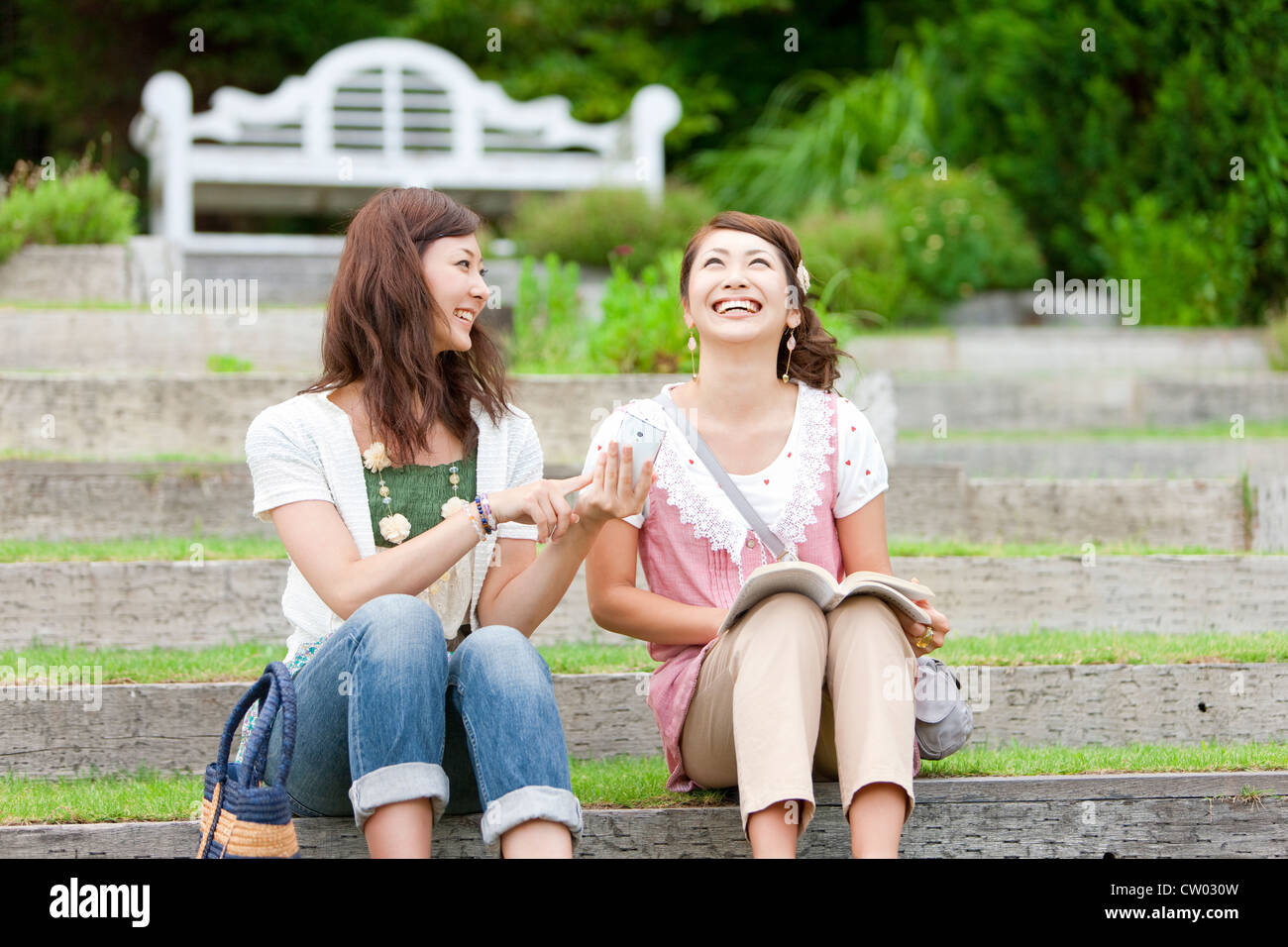 Two women using smart hi-res stock photography and images - Alamy