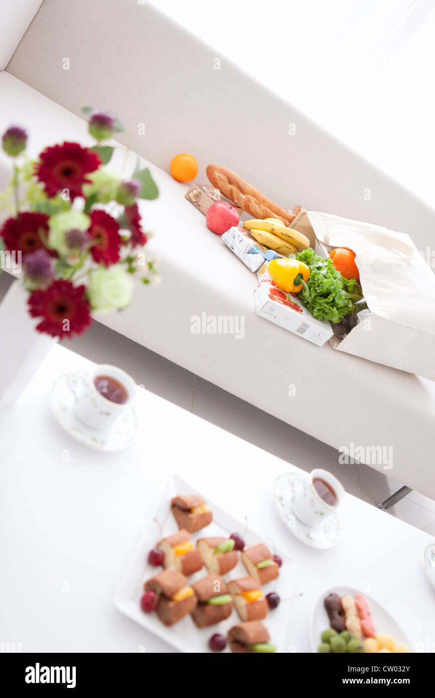 Groceries spilling on sofa Stock Photo - Alamy
