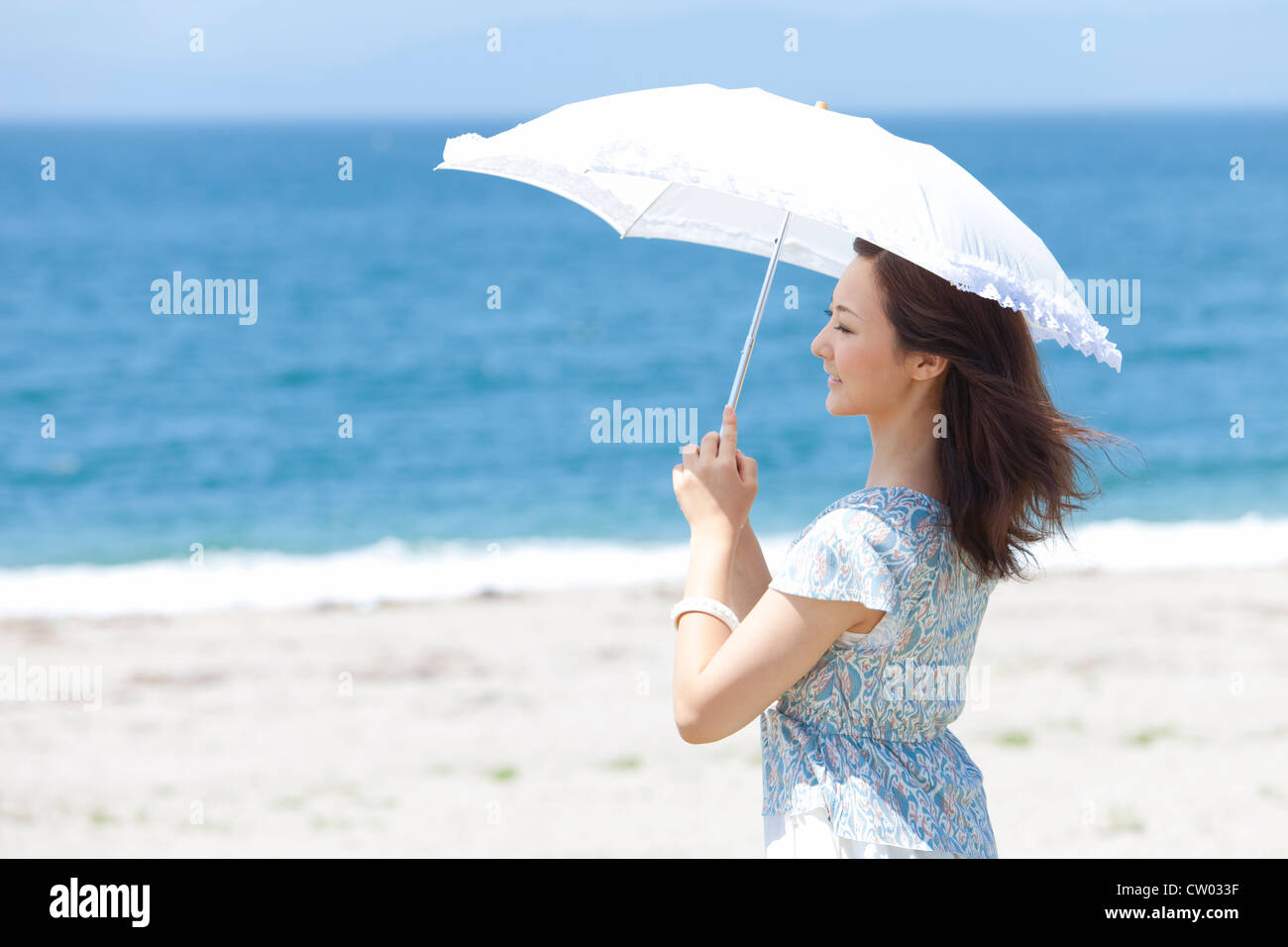 Woman with parasol hi-res stock photography and images - Alamy