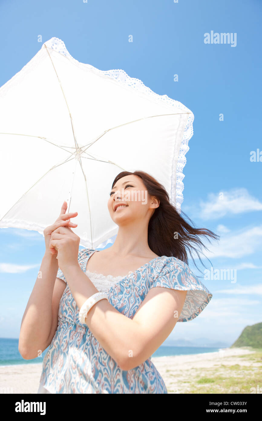 Woman with parasol hi-res stock photography and images - Alamy