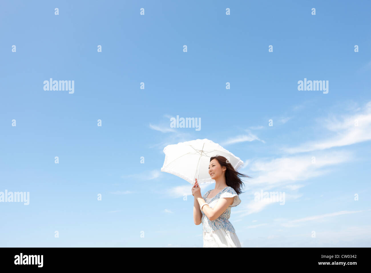 Woman with parasol hi-res stock photography and images - Alamy