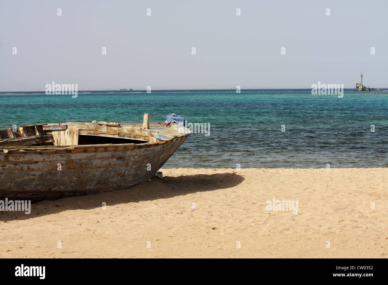 Boat on a sandy beach Stock Photo - Alamy