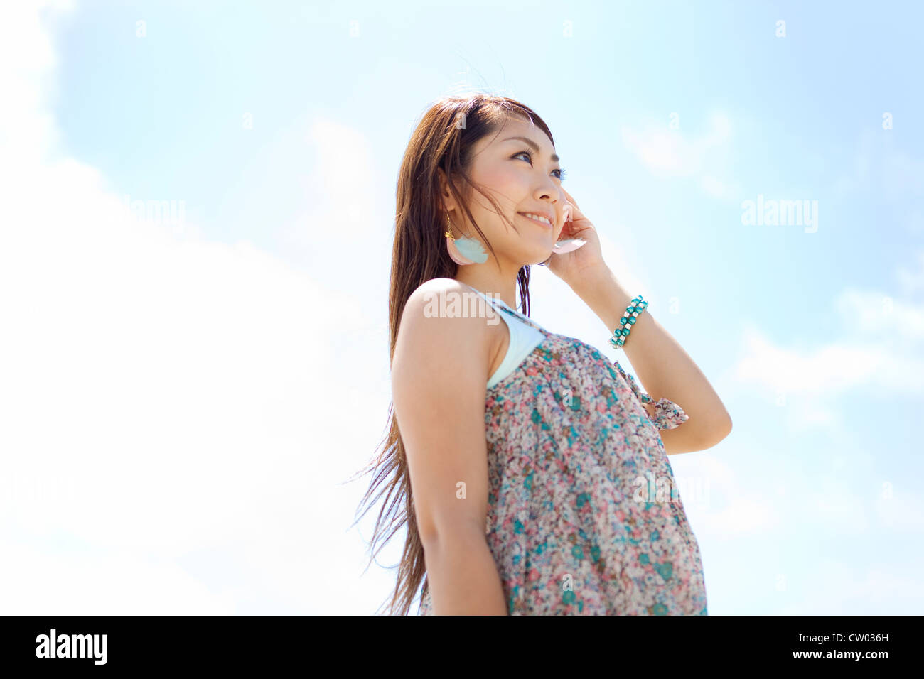 Woman standing, low angle view Stock Photo - Alamy