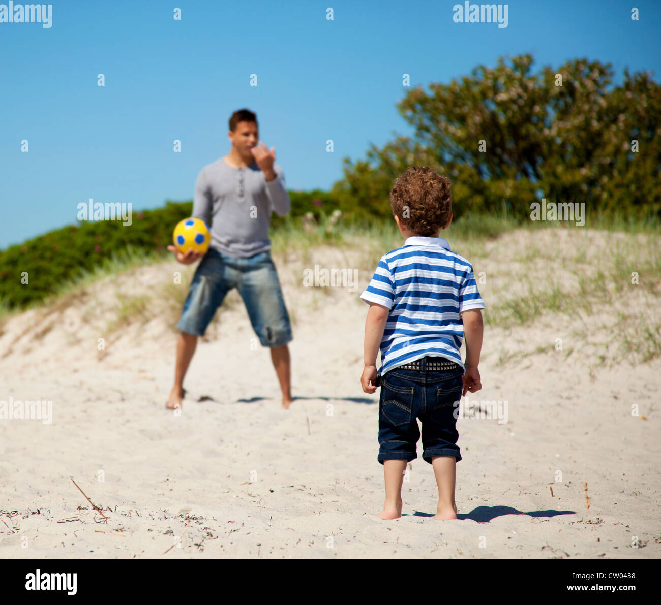 Father teaching son football hi-res stock photography and images - Alamy