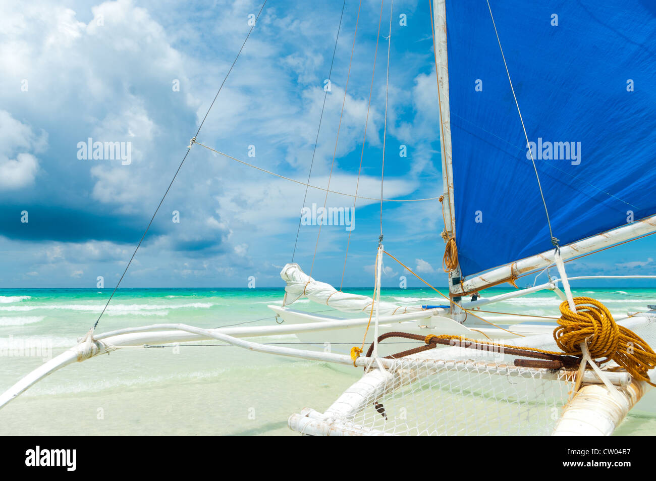detail of a traditional paraw sailing boats on white beach on boracay ...
