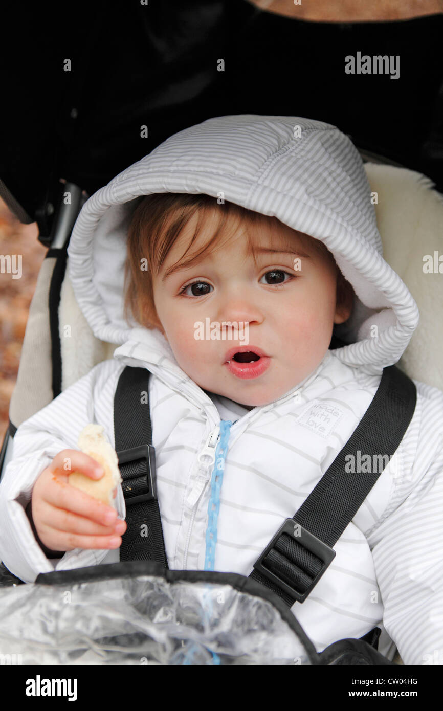 Boy riding in stroller outdoors Stock Photo - Alamy