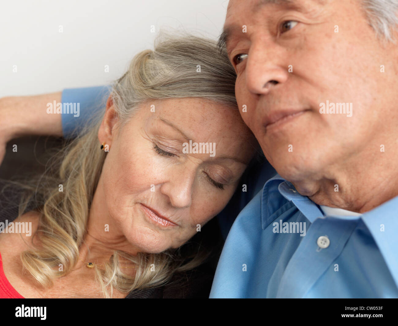 Older woman napping on husband Stock Photo - Alamy