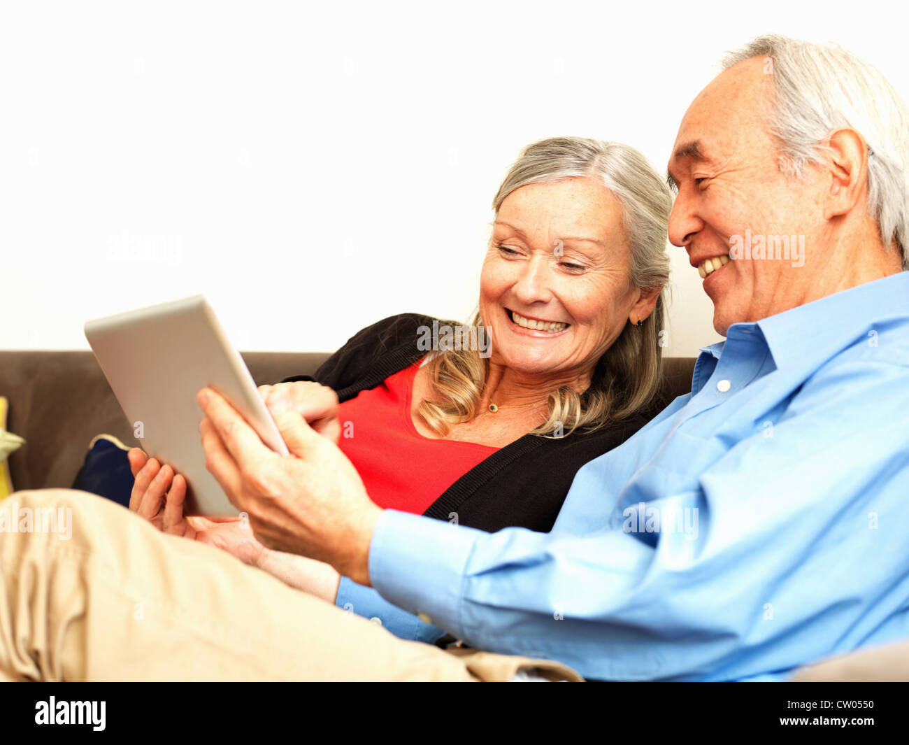 Asian senior couple using tablet hi-res stock photography and images ...