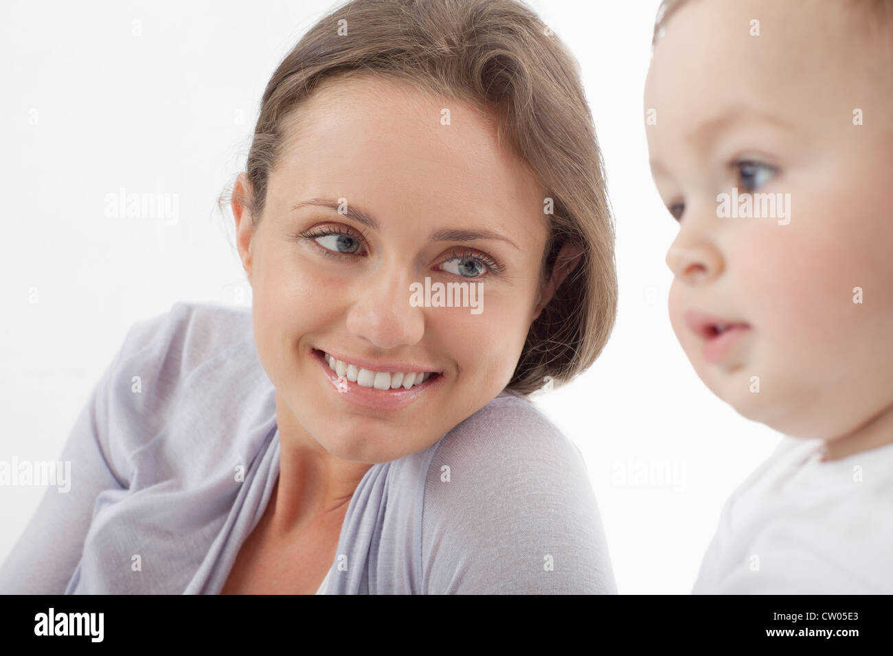 Mother smiling at baby Stock Photo - Alamy