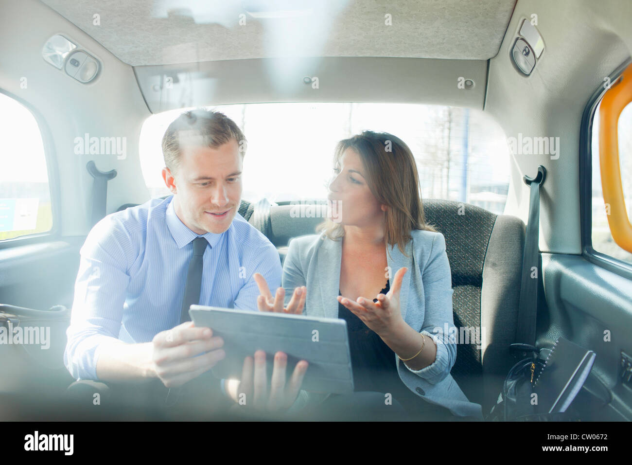 Business people using tablet computer Stock Photo - Alamy
