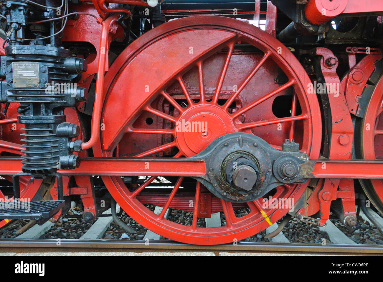 Red steel tyre railway wheel of a classic German steam locomotive type ...