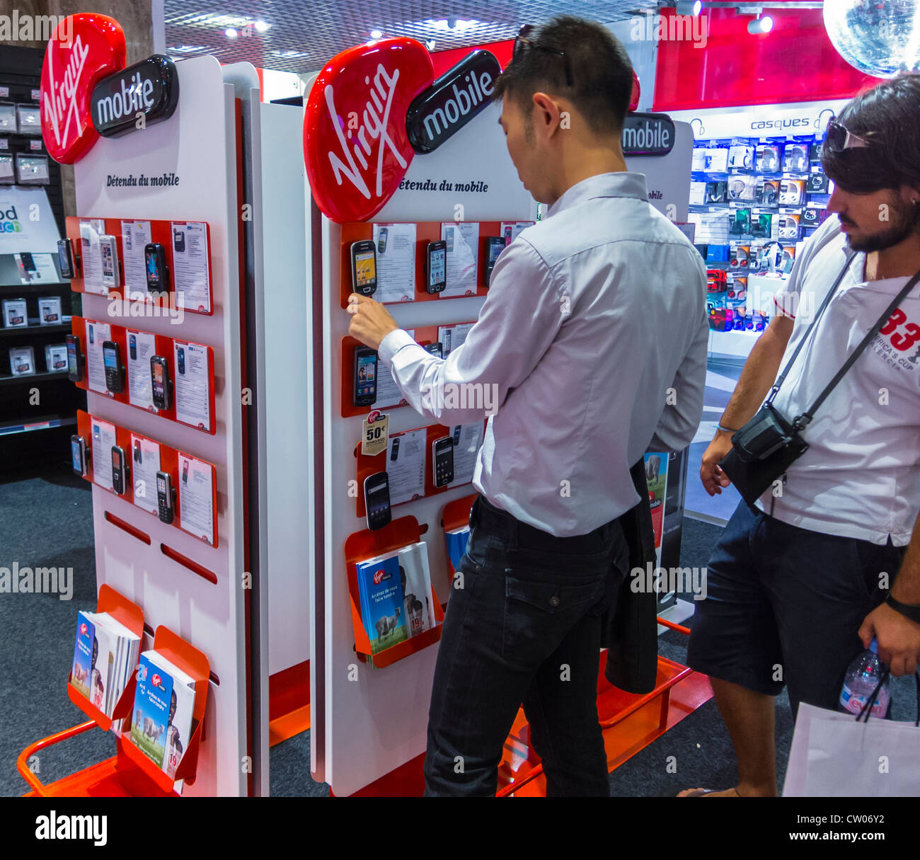 Young chinese man shopping inside virgin megastore hi-res stock ...