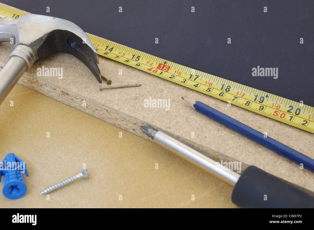 Arrangement of tools on a wooden board and sandpaper Stock Photo - Alamy