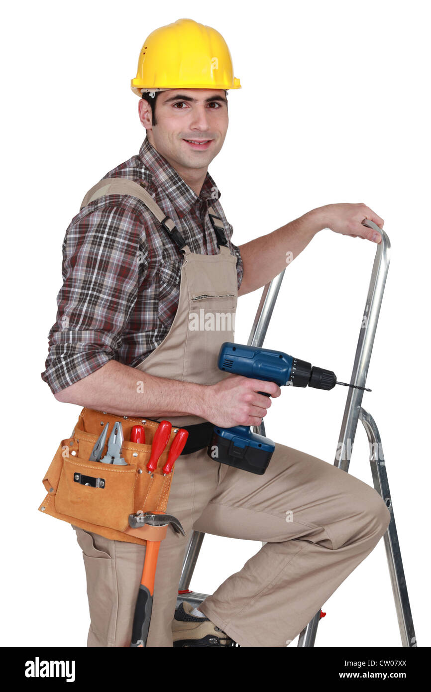 Man standing on ladder Stock Photo - Alamy