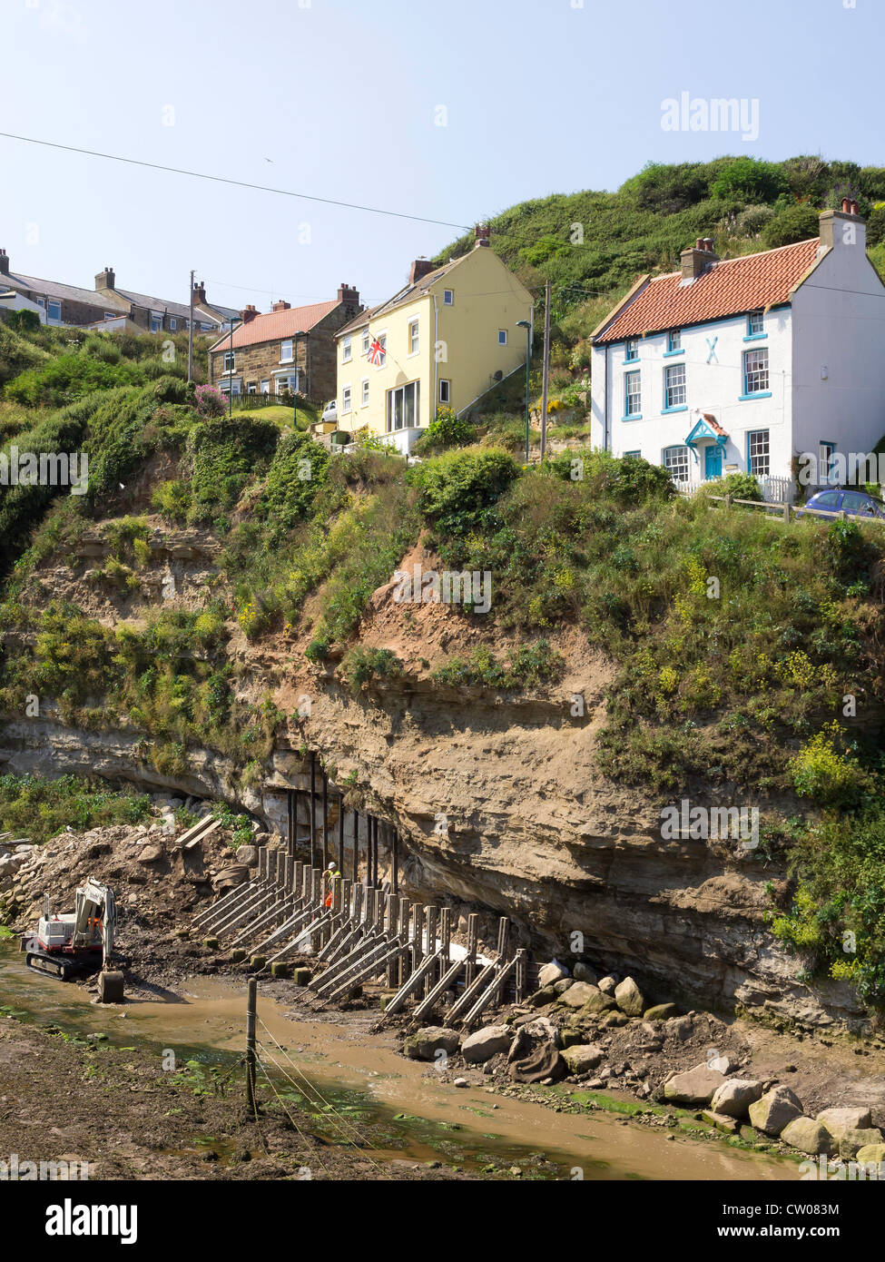 Civil engineering work underpinning a cliff where collapse would put a ...