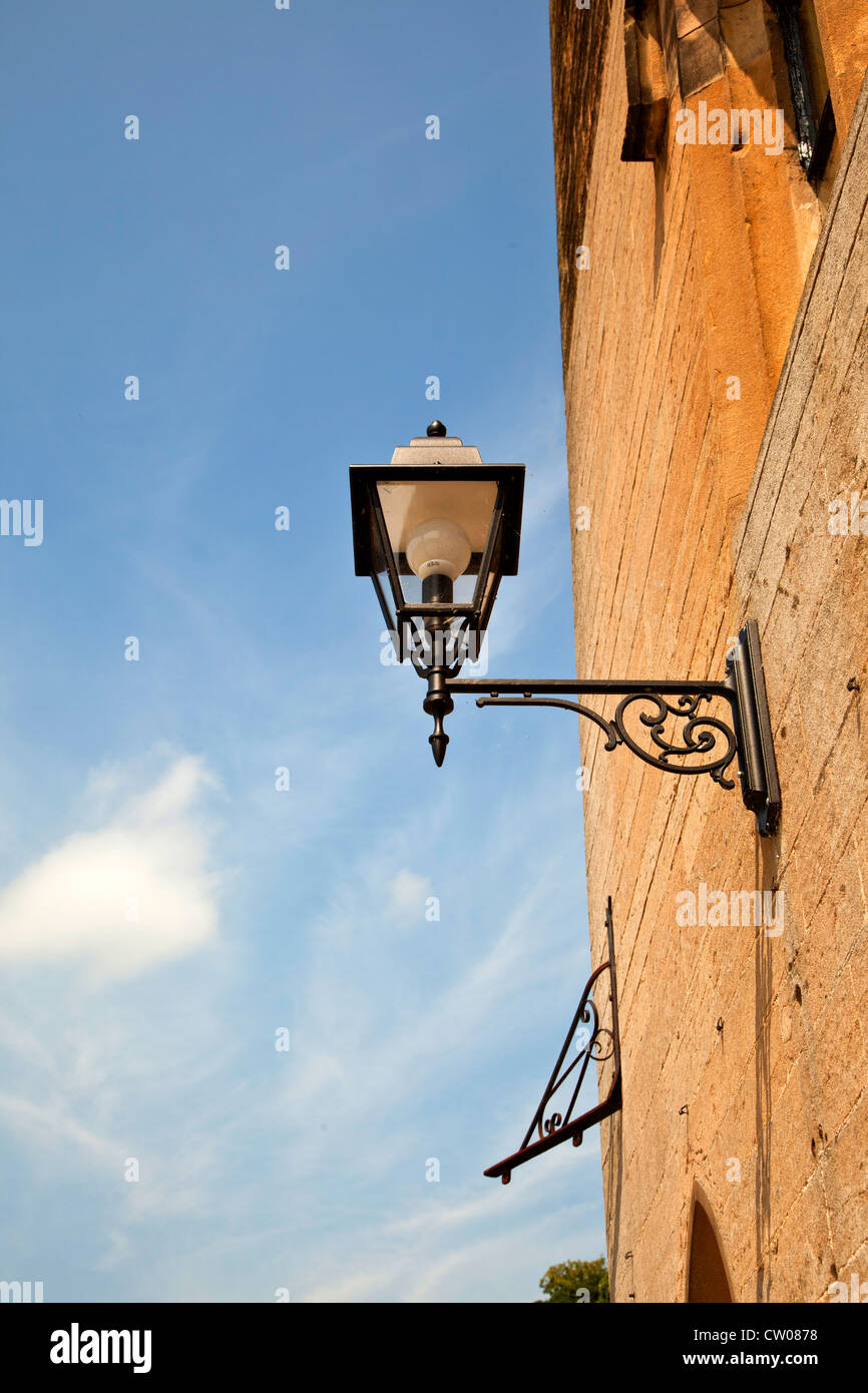 Lamp on building wall Stock Photo - Alamy
