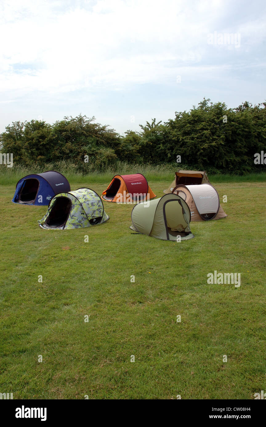 Group of instant pitching pop-up tents, ideal for beginner camping and ...