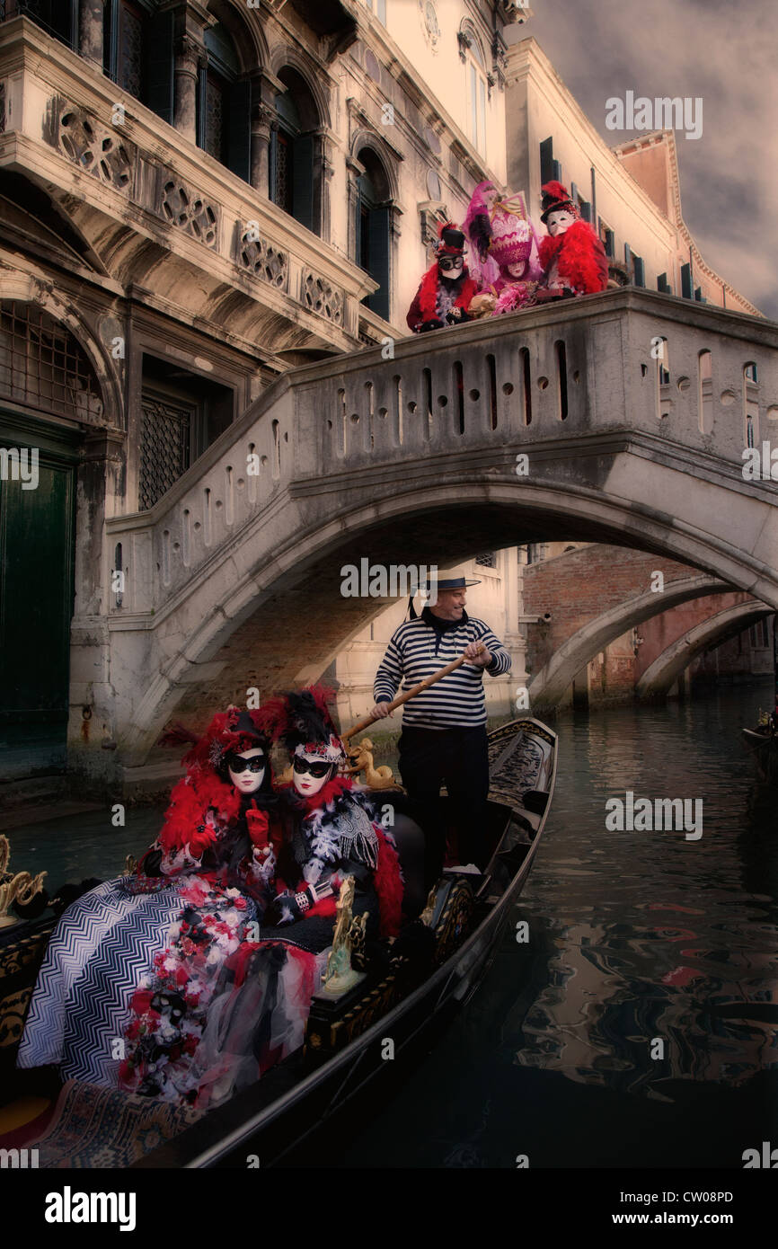 venice carnival models on a gondola Stock Photo - Alamy