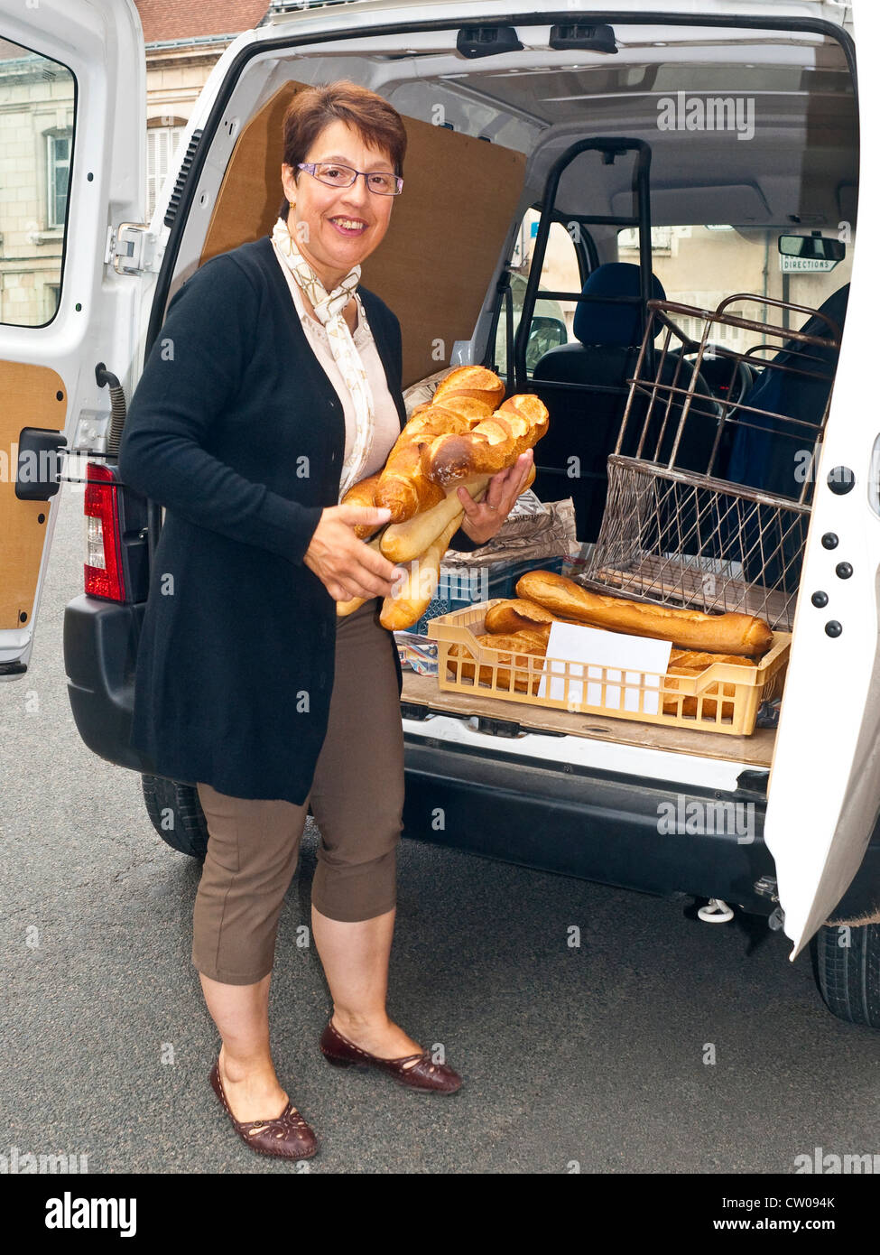 Van delivery woman with French breads and baguettes - France Stock ...